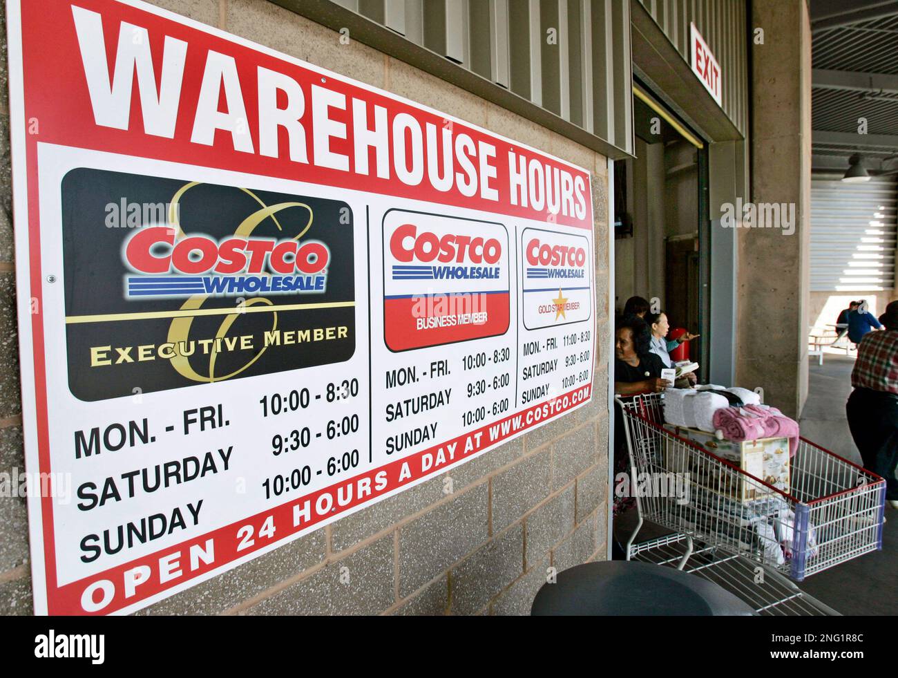 A Costco warehouse sign on display at the exit of a Costco store in San ...