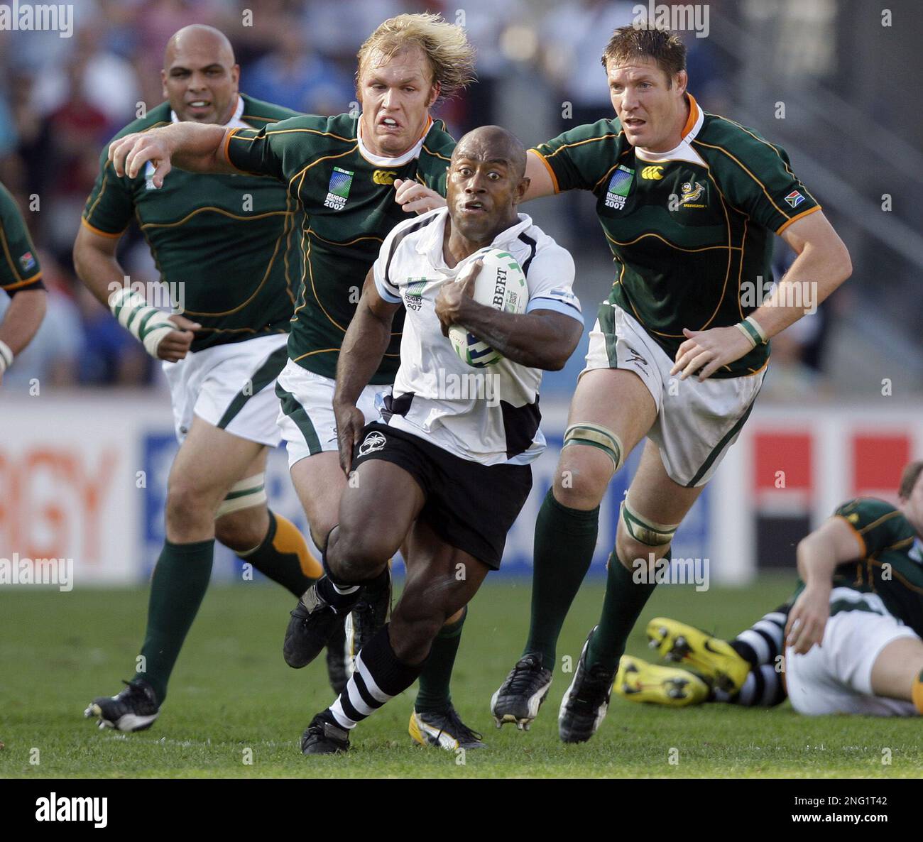 Fiji's Mosese Rauluni makes a break upfield as South Africa's Bakkies ...