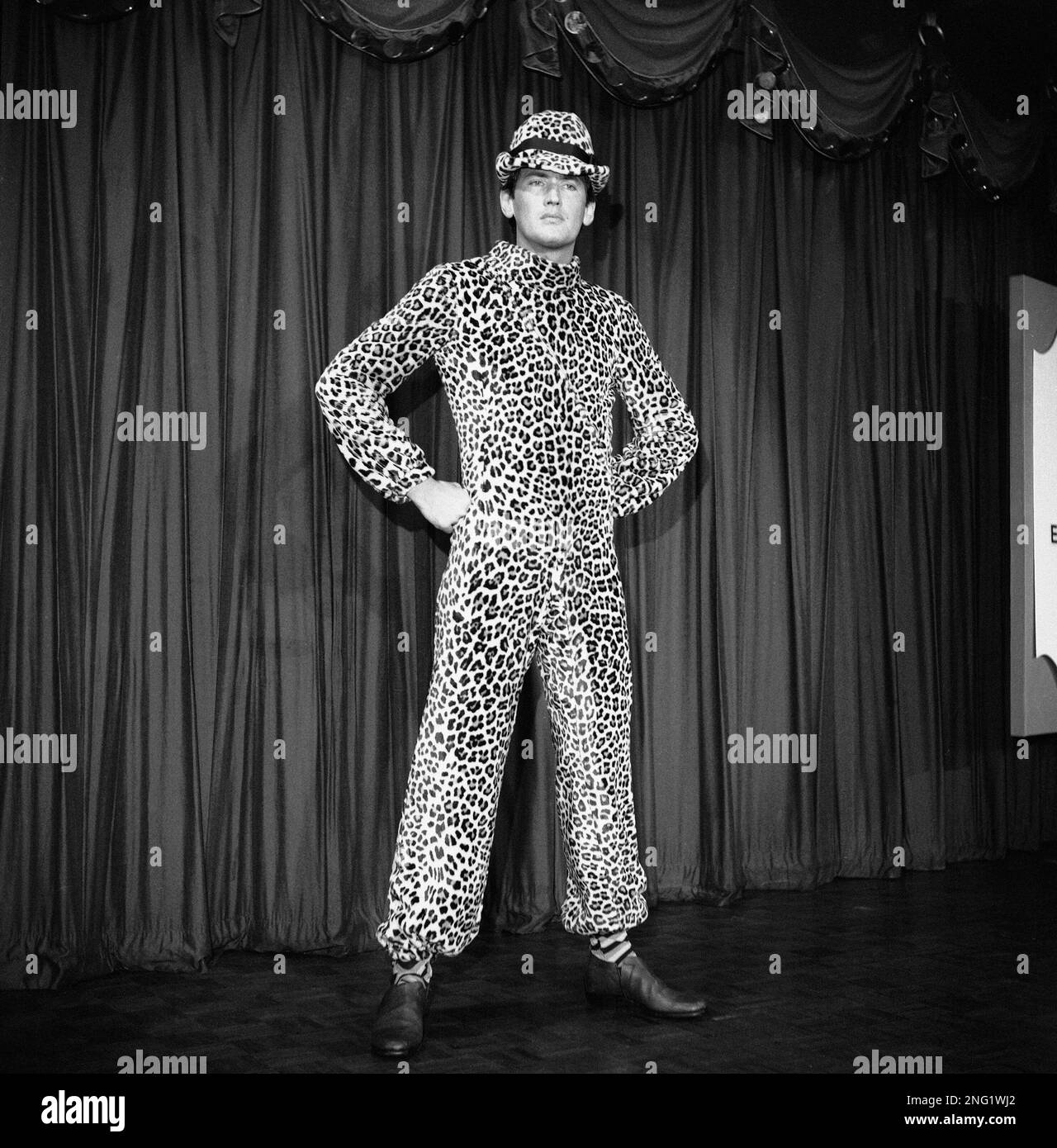 A male model wears a leopard print jump suit at a fashion show in New ...