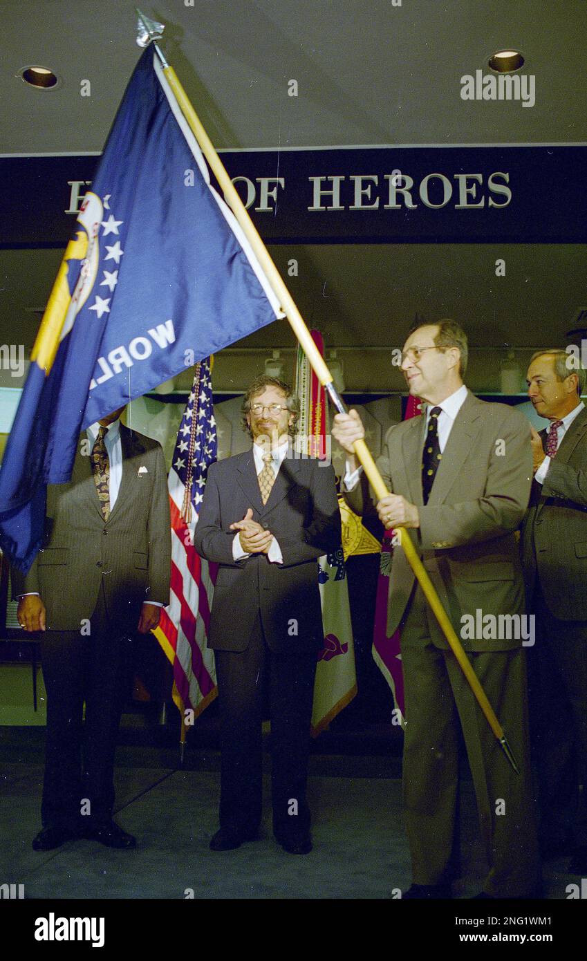 Defense Secretary William Perry, right, presents a World War II flag to ...