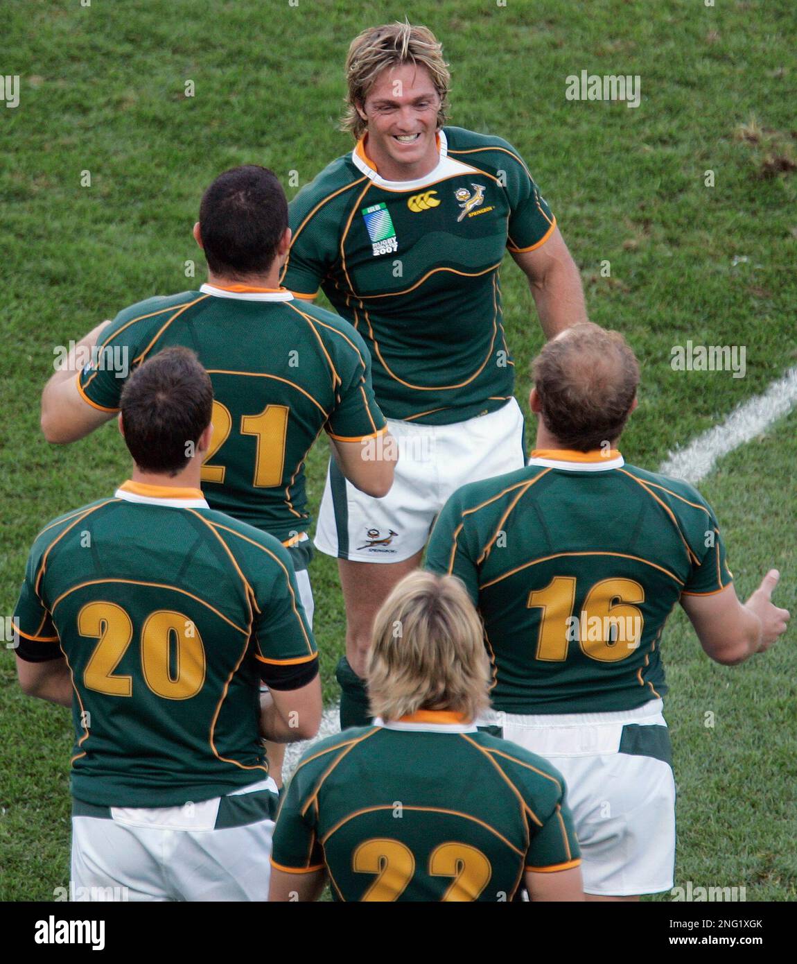 Percy Montgomery of South Africa, rear, greets his teammates after the ...