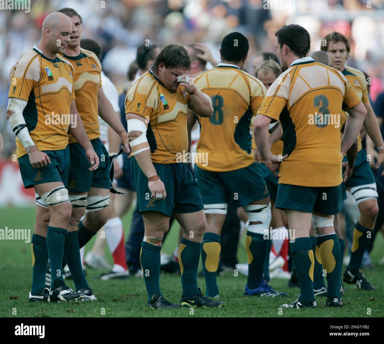 Australian players react after their Rugby World Cup quarterfinal match ...
