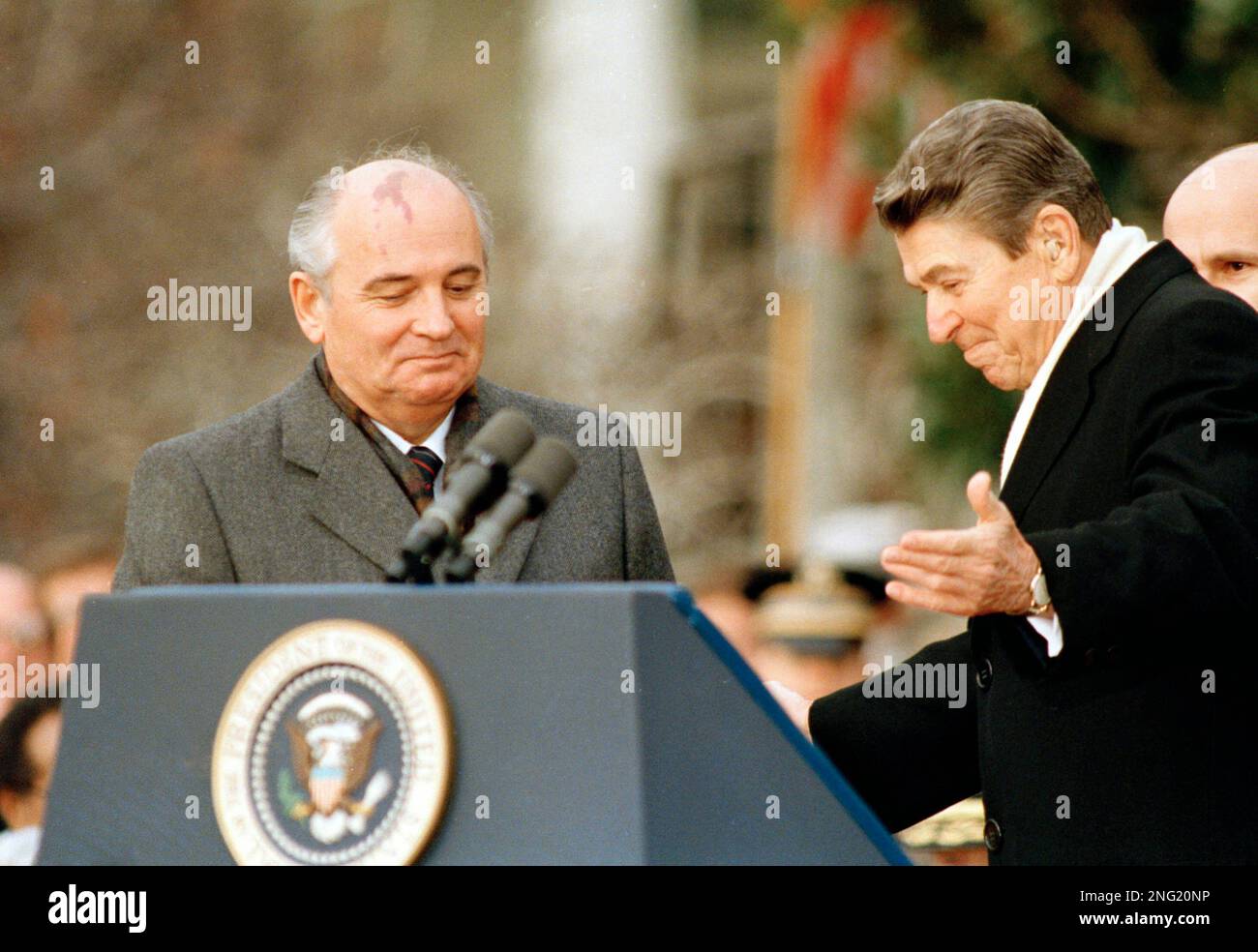 President Ronald Reagan gestures to Soviet leader Mikhail Gorbachev ...