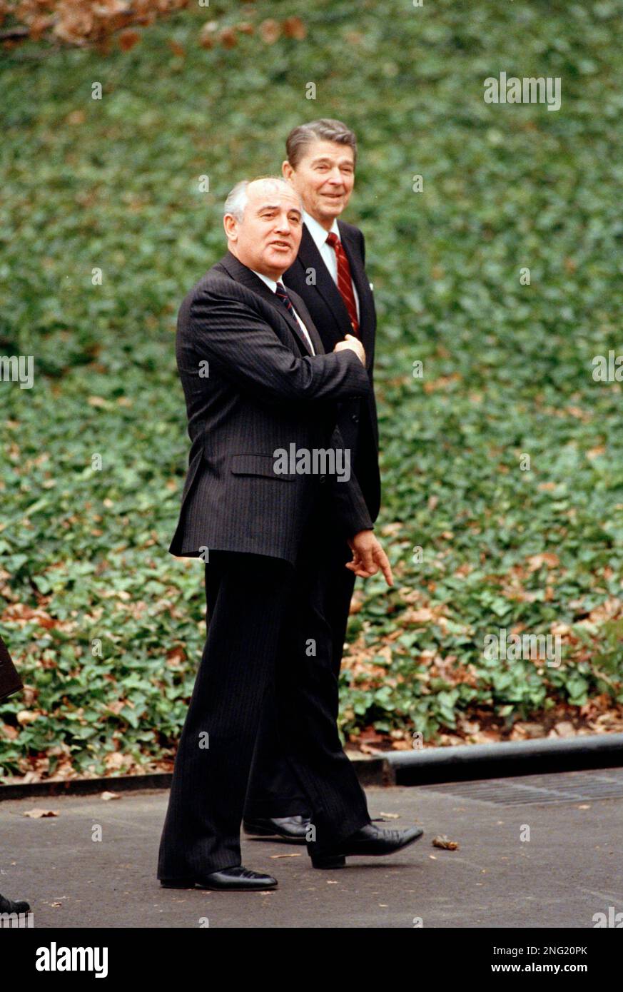 Soviet leader Mikhail Gorbachev points to President Ronald Reagan as ...