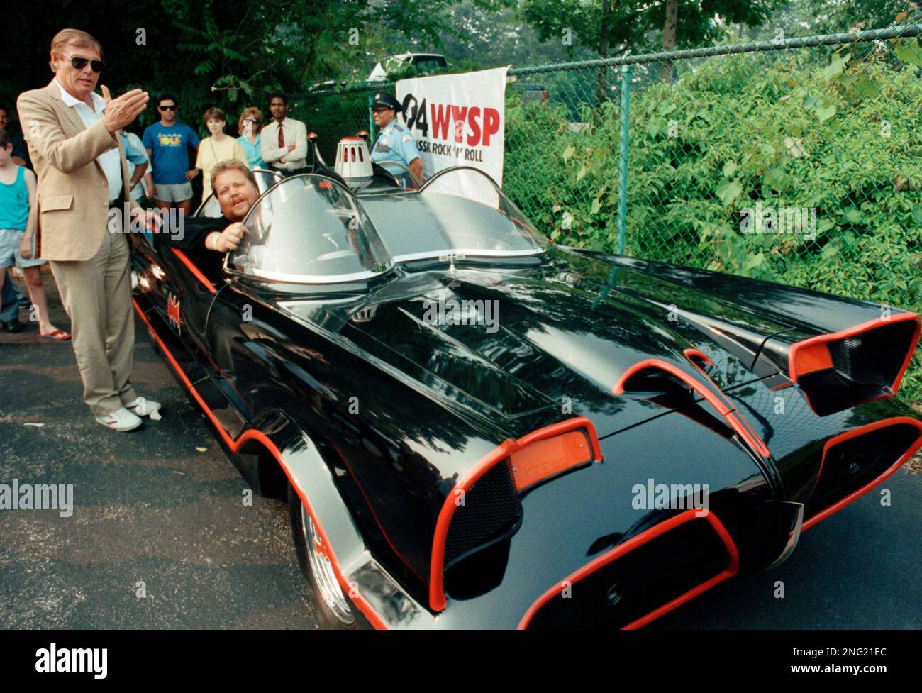 The original Batman Adam West stands beside the old Batmobile driven by ...