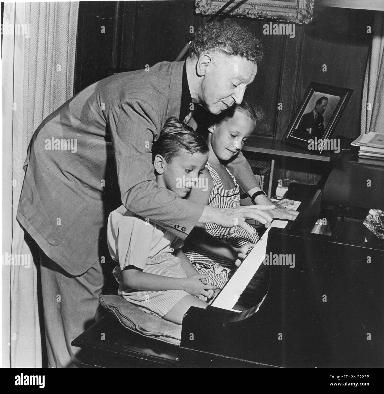 Pianist Arthur Rubinstein is seen with his children, John and Eva, date ...