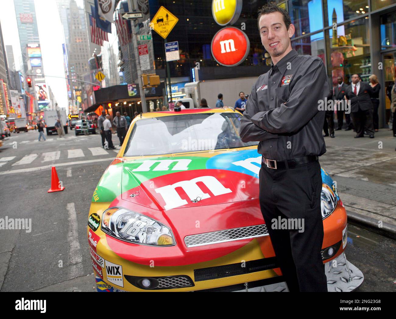 NASCAR driver Kyle Busch poses after the unveiling of the new M&M ...