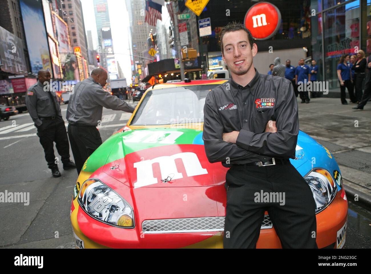 NASCAR driver Kyle Busch poses after the unveiling of the new M&M ...