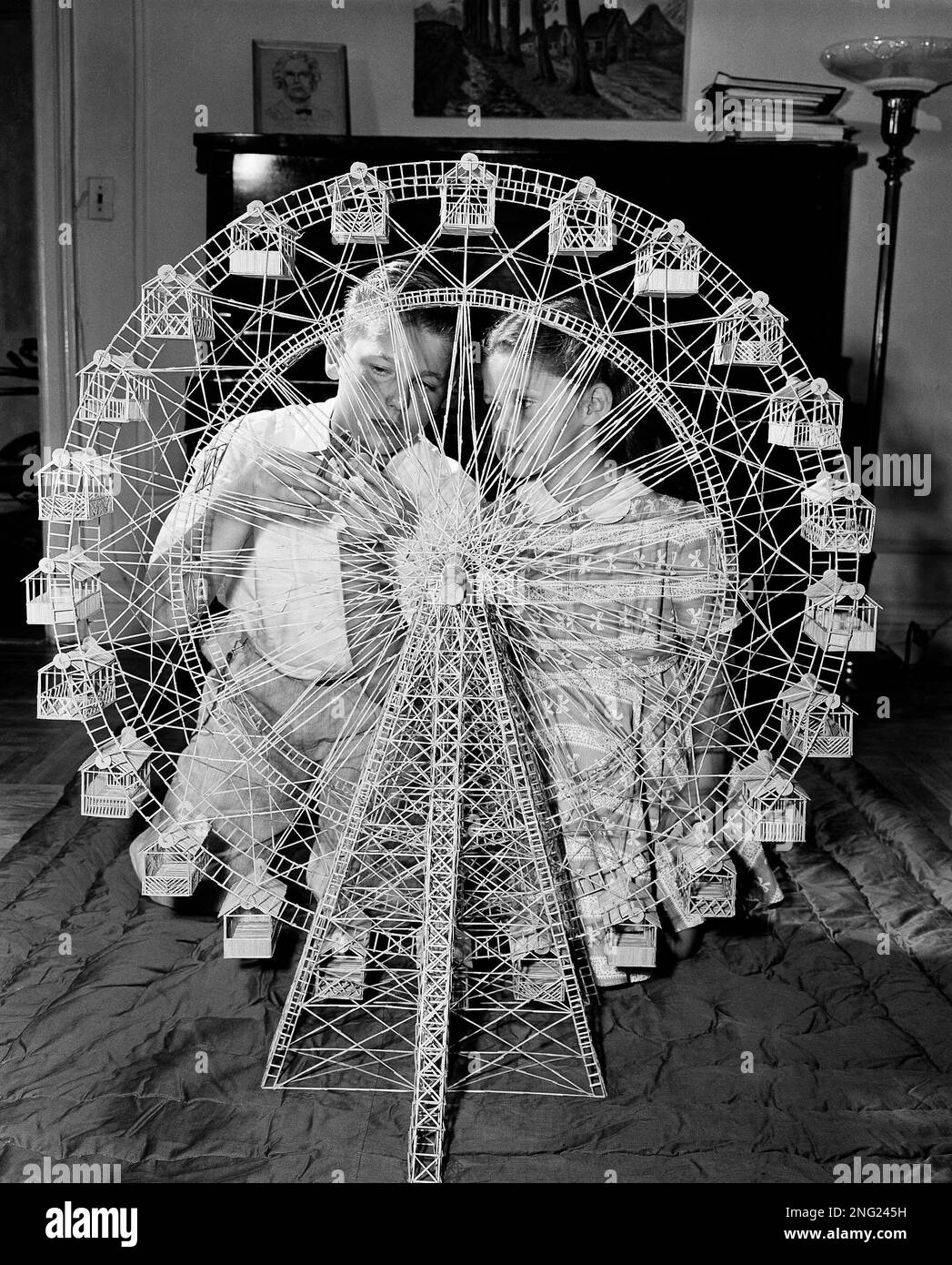 14-year-old Barry Pariser, checks on the movable ferris wheel which he ...