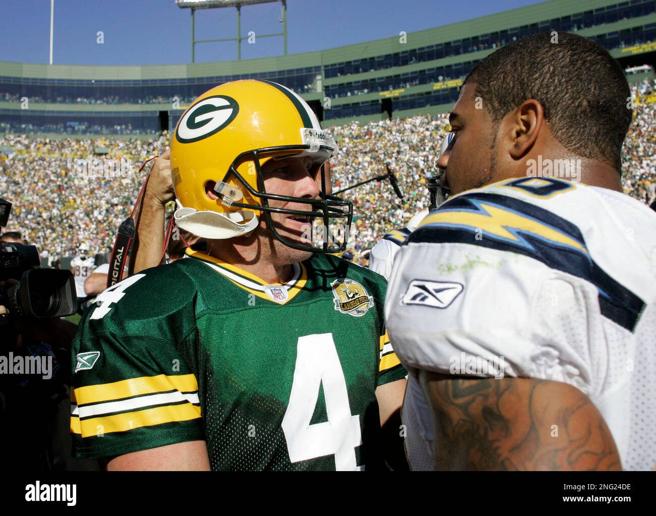 Green Bay Packers Brett Favre (4) talks with San Diego Chargers Shawne ...