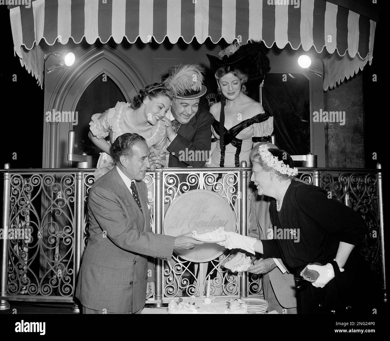 New York Mayor Vincent Impellitteri presents a piece of anniversary ...