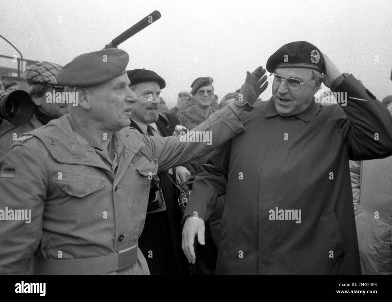 West German Chancellor Helmut Kohl, wearing a tank soldier's baret, as ...