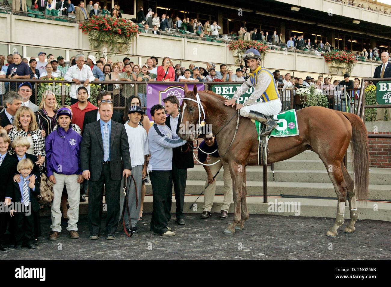 Curlin, with jockey Robby Albarado atop, stands in the winner's circle ...