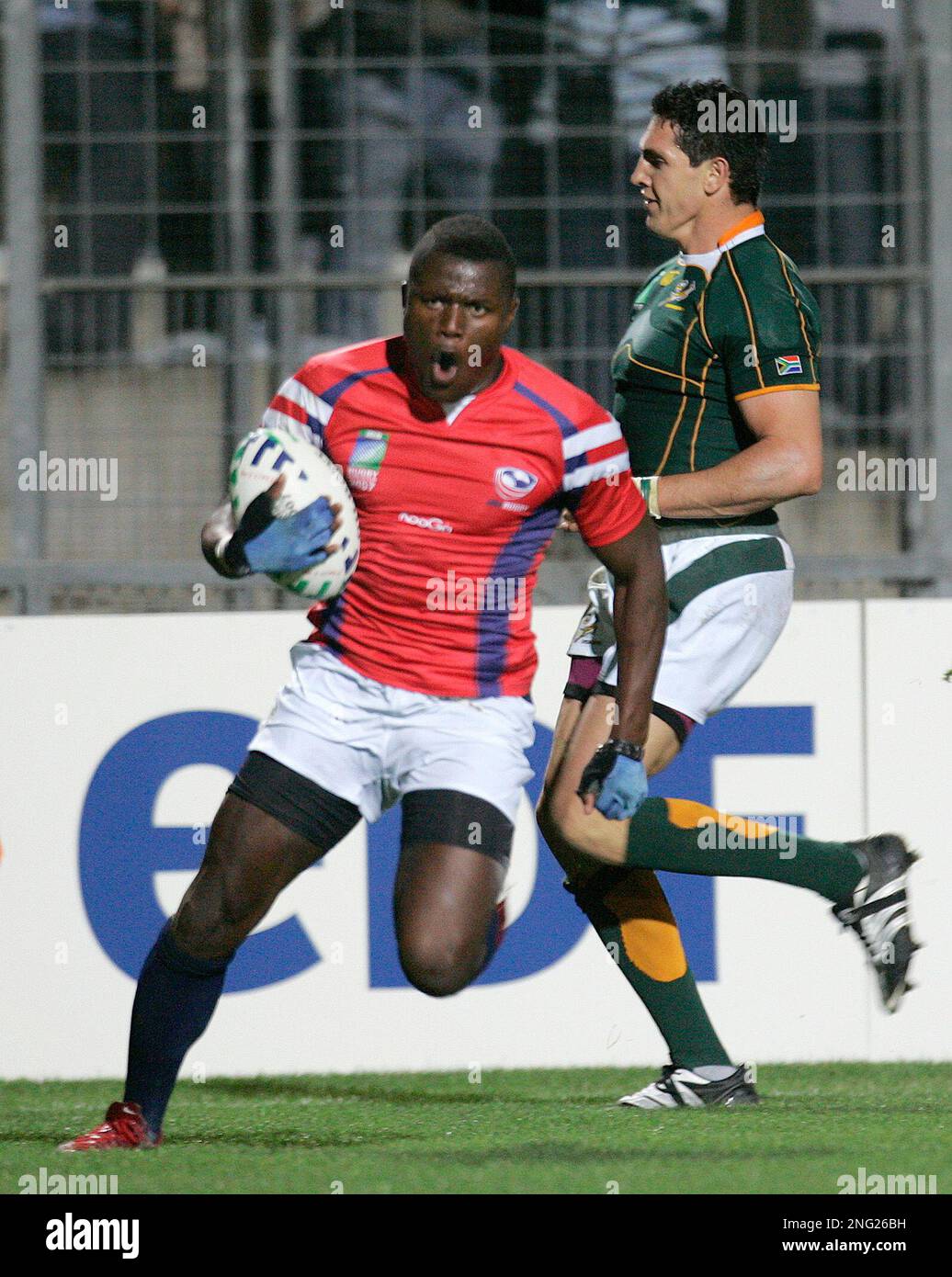 United States' Takudzwa Ngwenya, left, celebrates after scoring a try ...