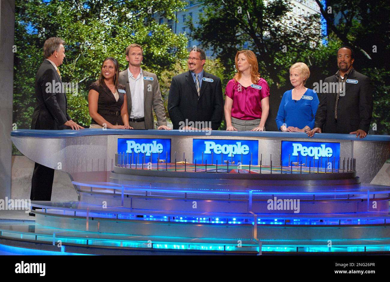 Host Pat Sajak (L), contestant Megan Sippey, actor Neil Patrick Harris ...