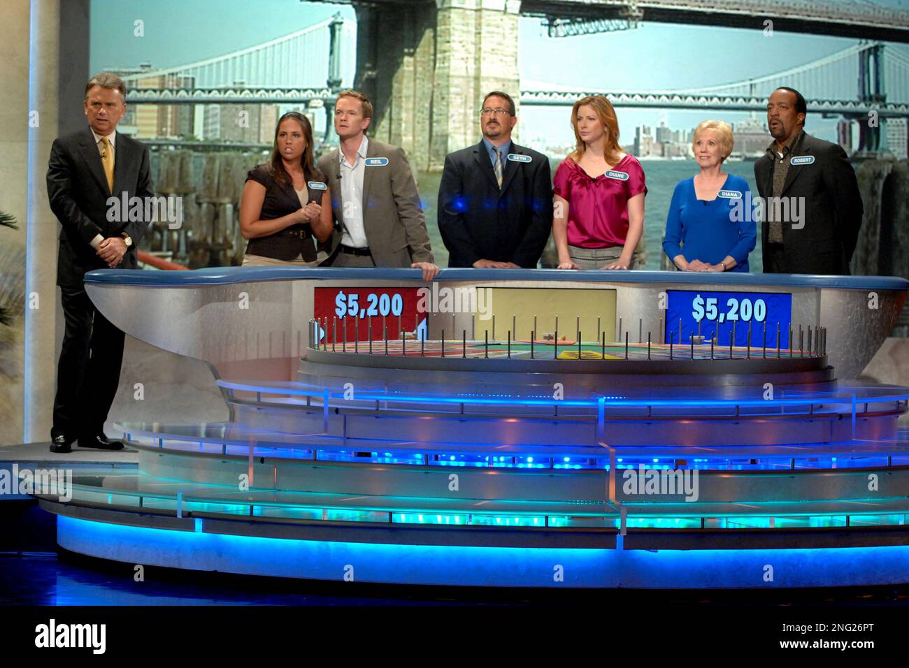 Host Pat Sajak (L), contestant Megan Sippey, actor Neil Patrick Harris ...