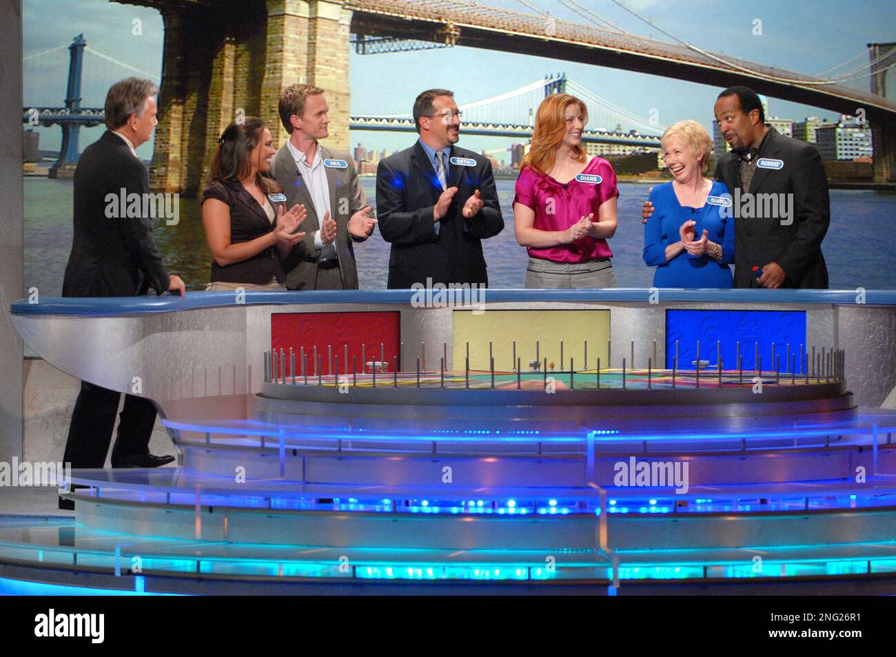 Host Pat Sajak (L), contestant Megan Sippey, actor Neil Patrick Harris ...