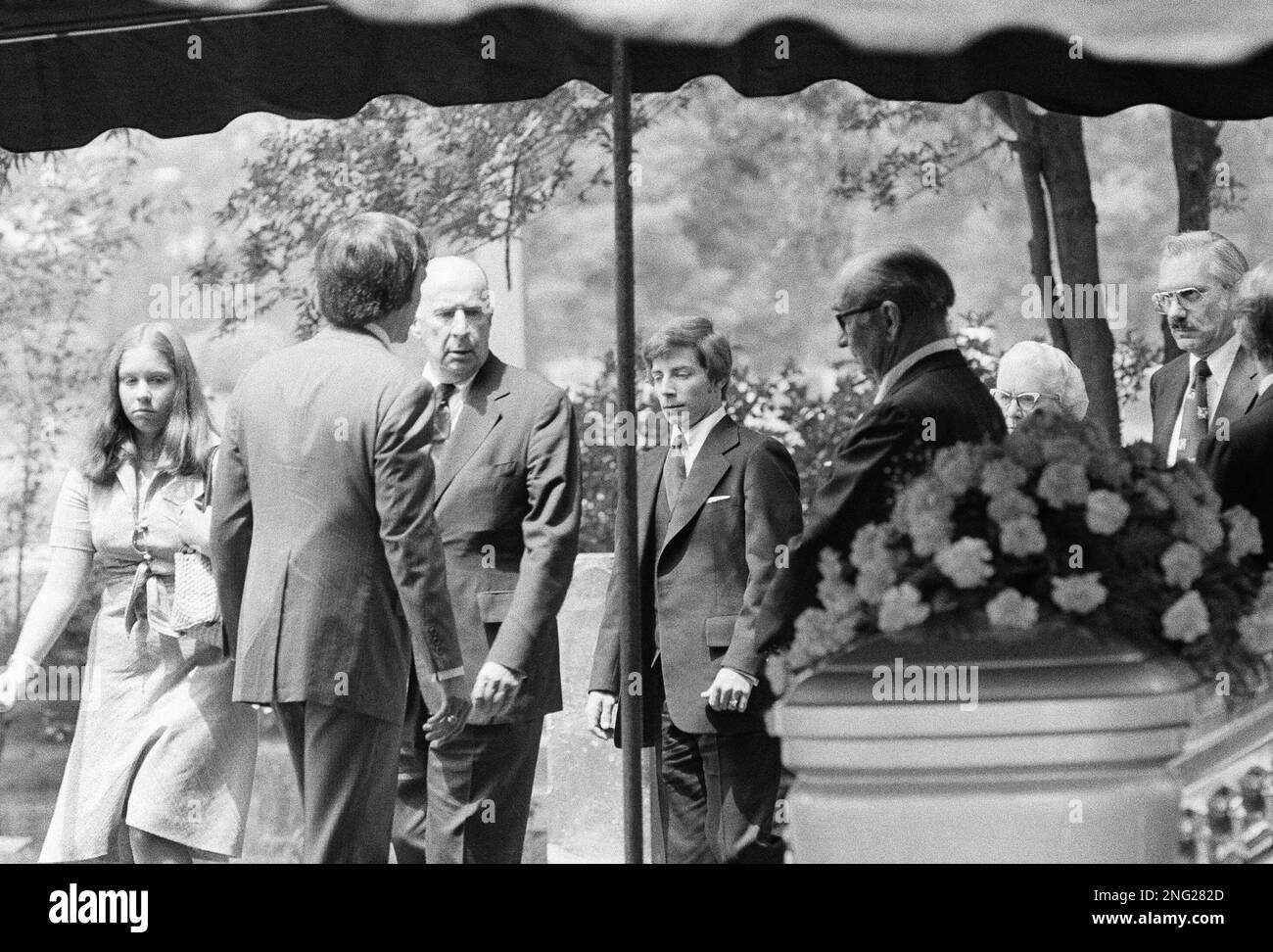 Former U. S. Attorney General John Mitchell, center, looks back at the ...