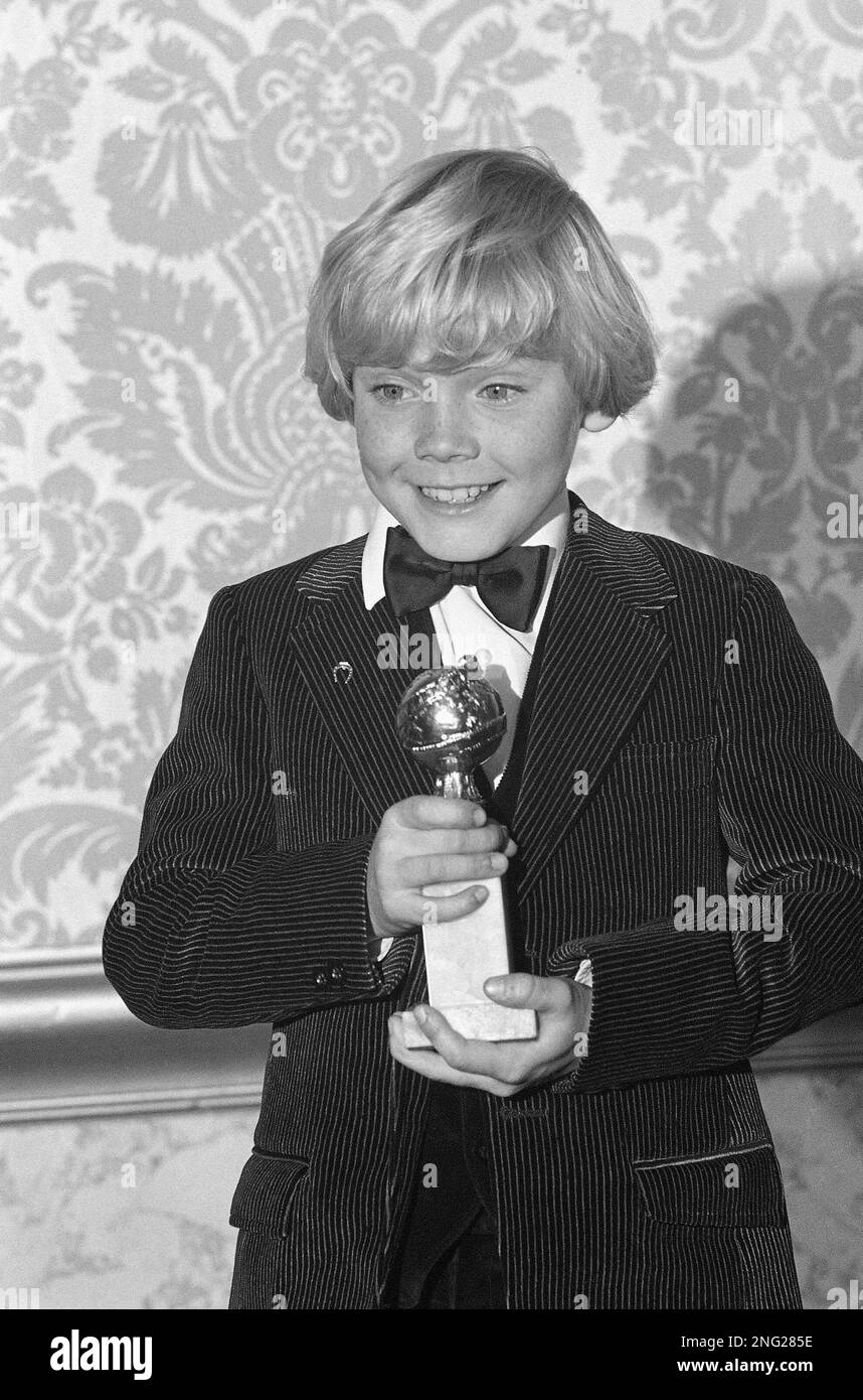 Child actor Ricky Schroder clutches his award presented him for New ...
