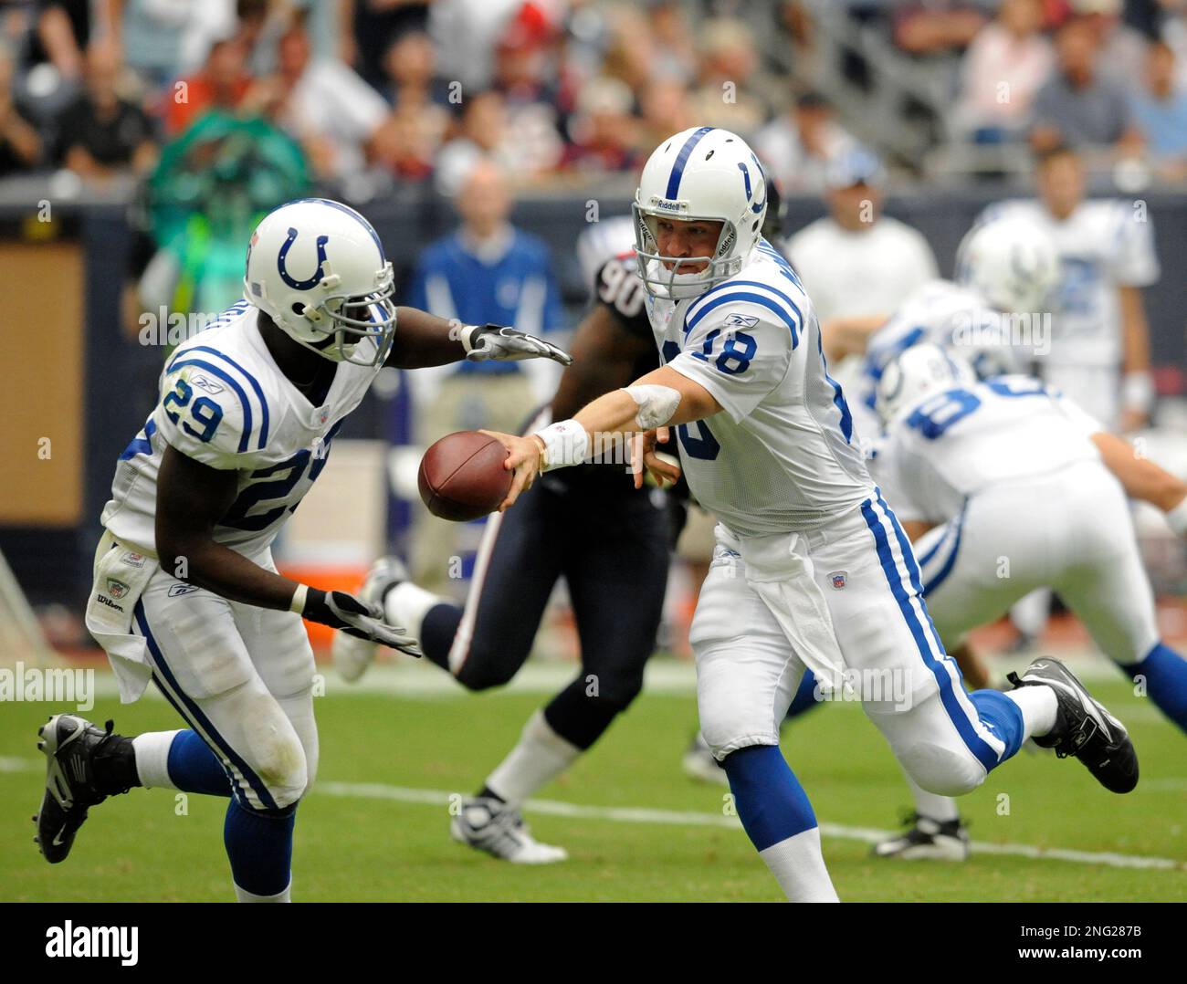 Indianapolis Colts' Peyton Manning hands the ball off to Joseph Addai ...