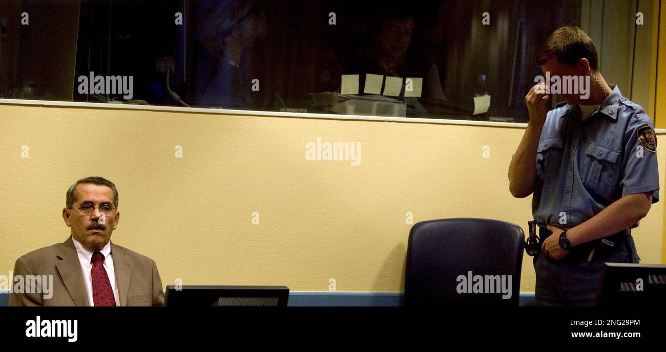 Former Kosovo camp guard Haradin Bala sits in the courtroom of the ...