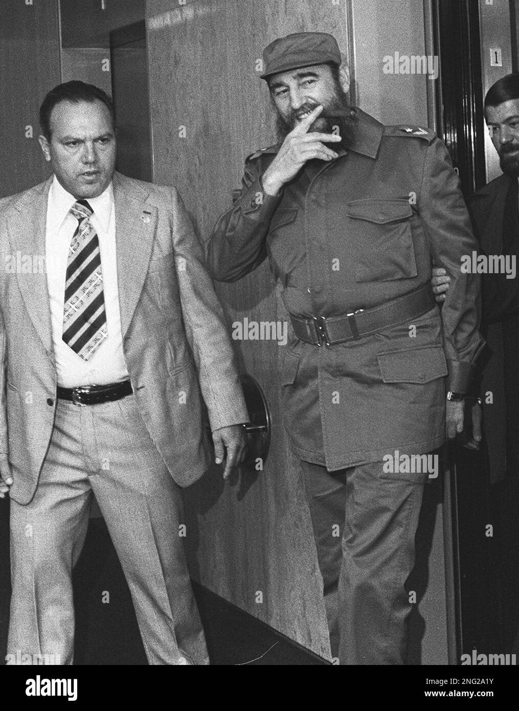 Cuban President Fidel Castro arrives wearing his trademark green ...