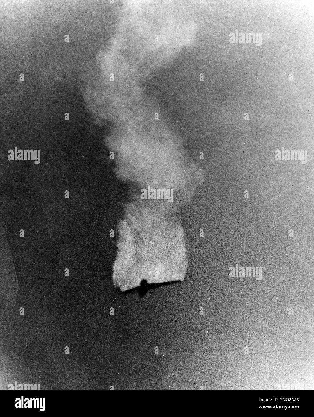 A BOAC Boeing 707-436 that broke up in the air, falls to earth trailing ...