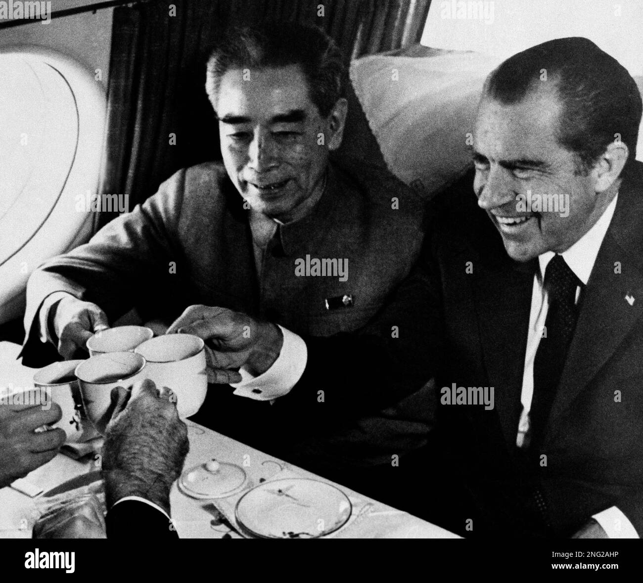 Chou En-lai and U.S. President Richard Nixon toast two others on the ...