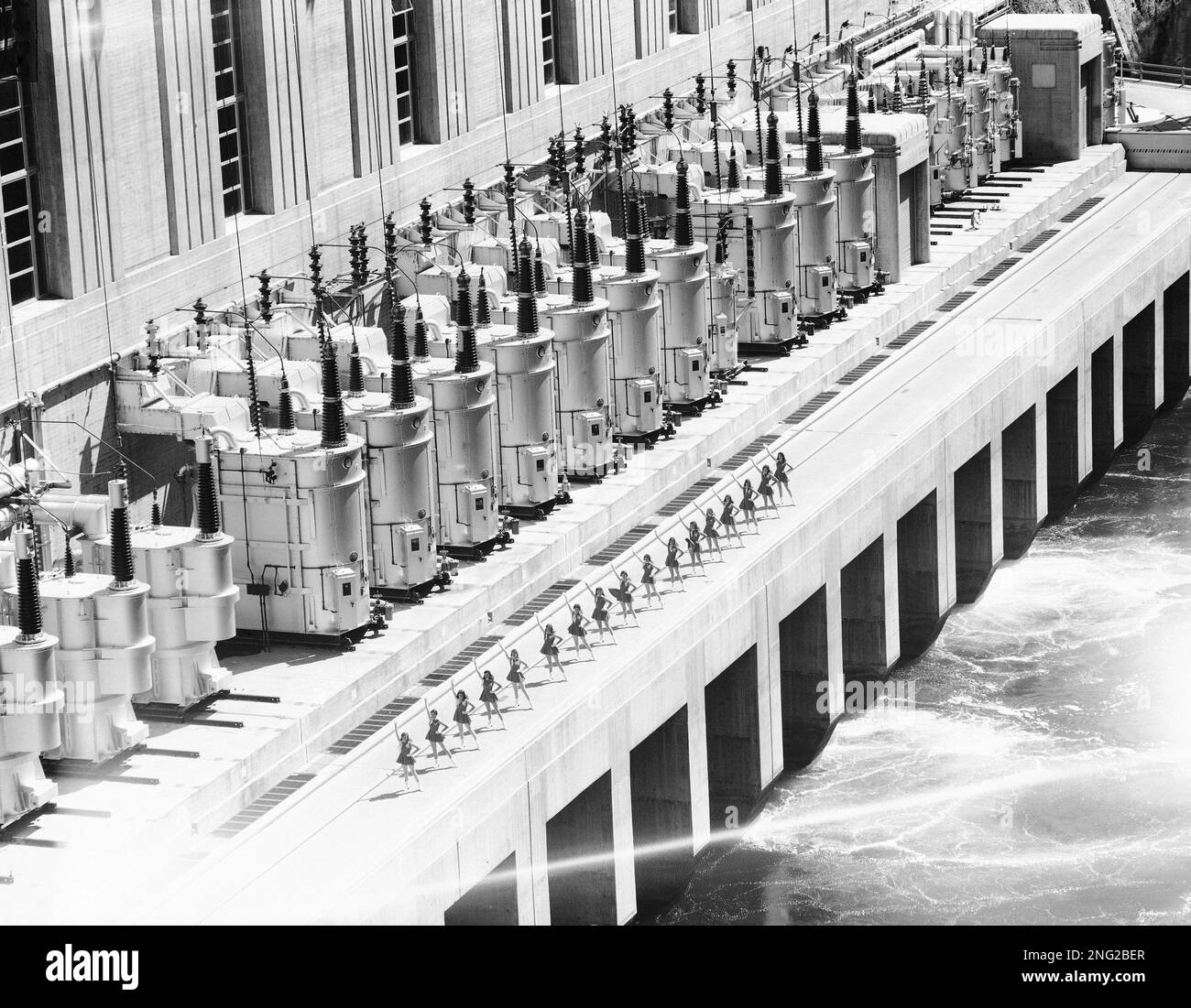 The huge power transformers of Hoover Dam dwarf the girls of the Las ...