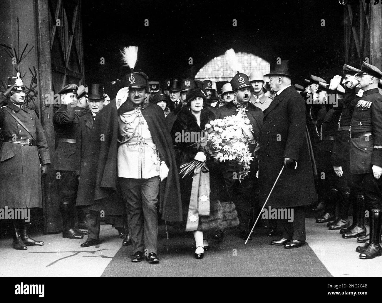 King Amanullah Khan of Afghanistan, left saluting, with his wife Queen ...