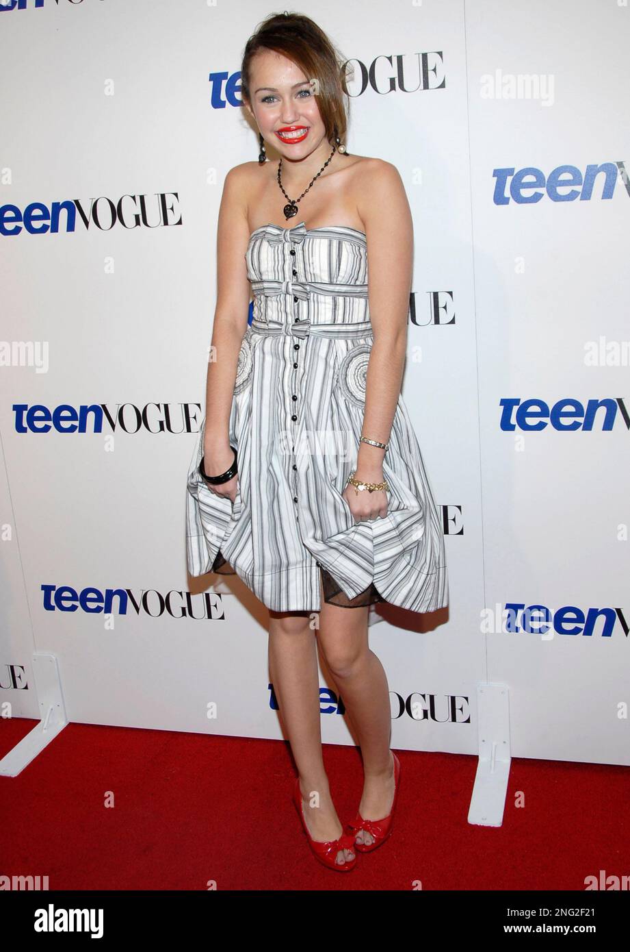 Actress Miley Cyrus poses on the press line at the Teen Vogue Young ...