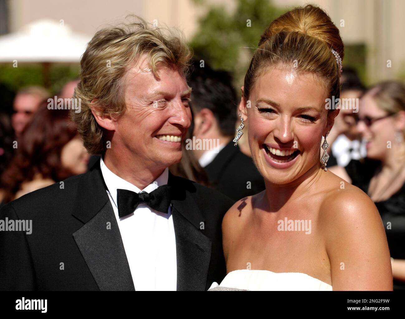 Nigel Lythgoe, left, and Cat Deeley arrive at the 59th Primetime Emmy ...