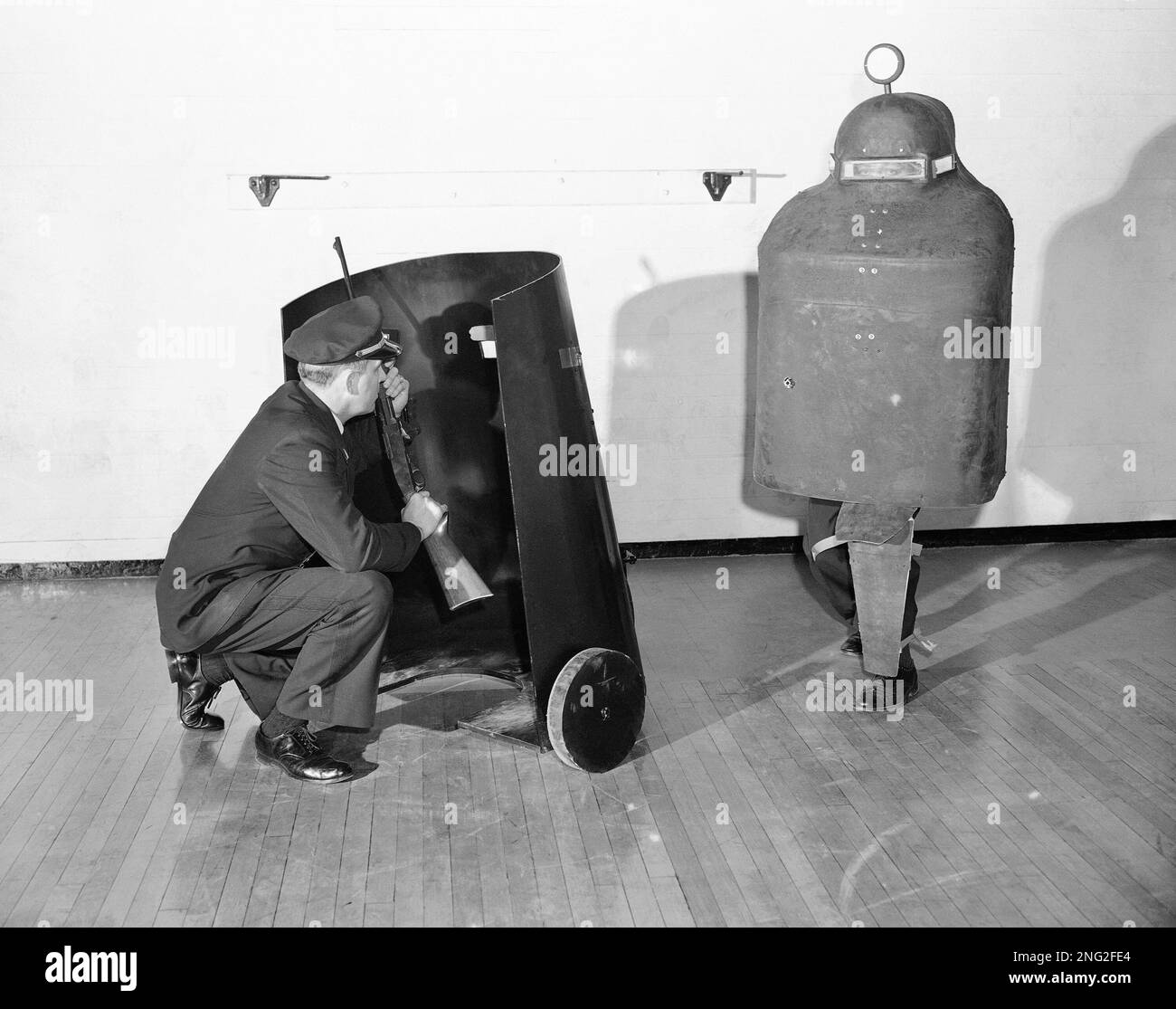 Detroit policemen demonstrate steel armor in Detroit, Mich., Jan. 18 ...