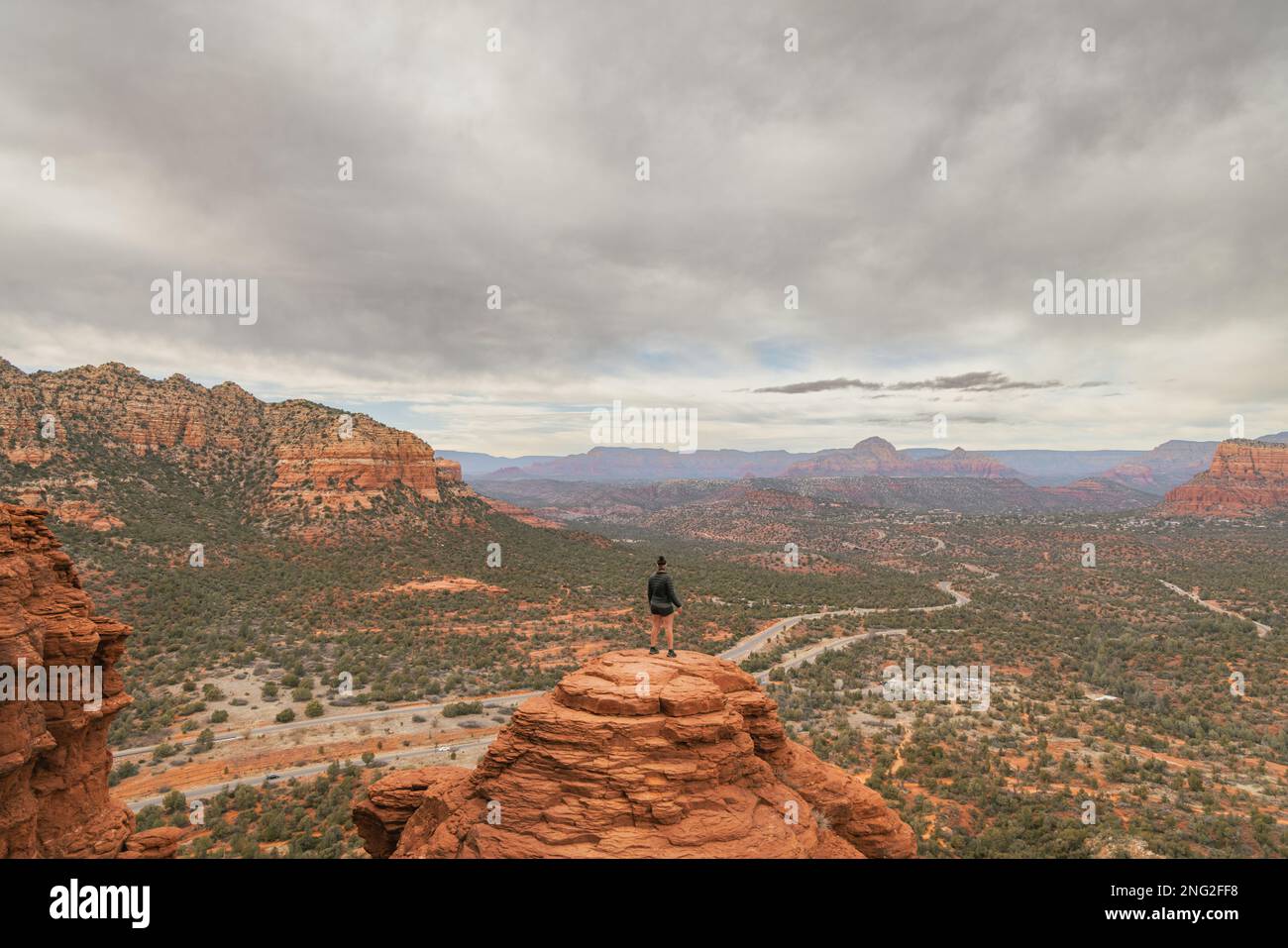 Woman hiker standing on Bell Rock with incredible views within coconino ...