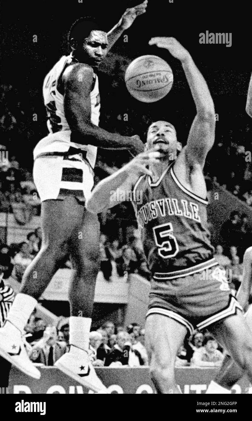 DePaul University's All-American Mark Aguirre (24) jumps over the ...
