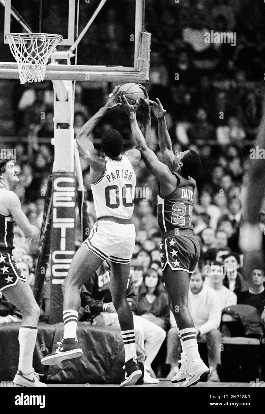 Boston Celtics Robert Parish snatches the ball from Washington Bullets ...