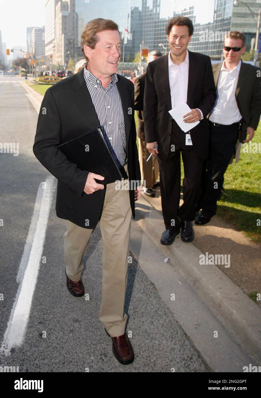 Ontario Progressive Conservative leader John Tory, left, laughs with ...