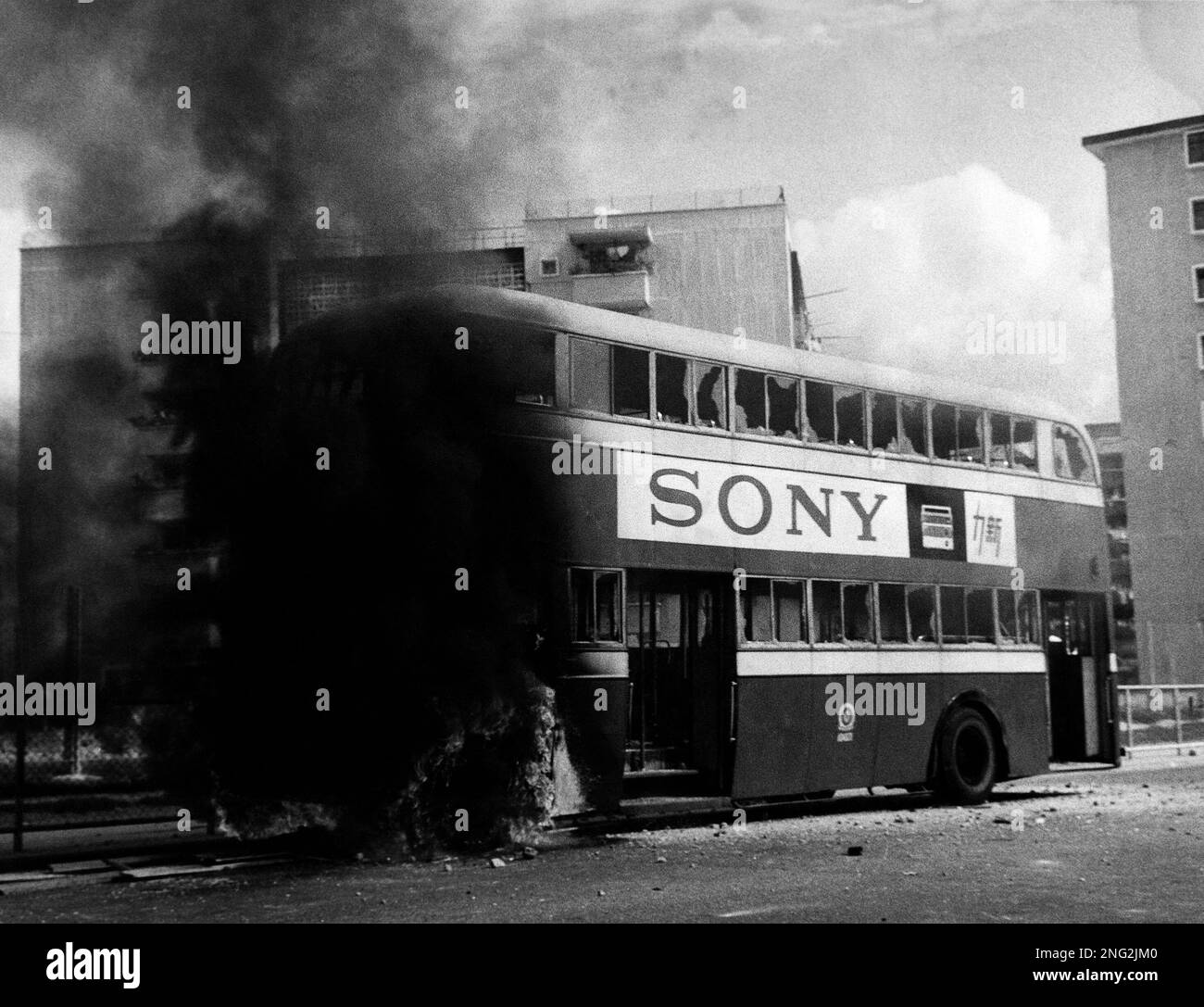 Double decker bus burns on street leading to Sanpokong industrial ...