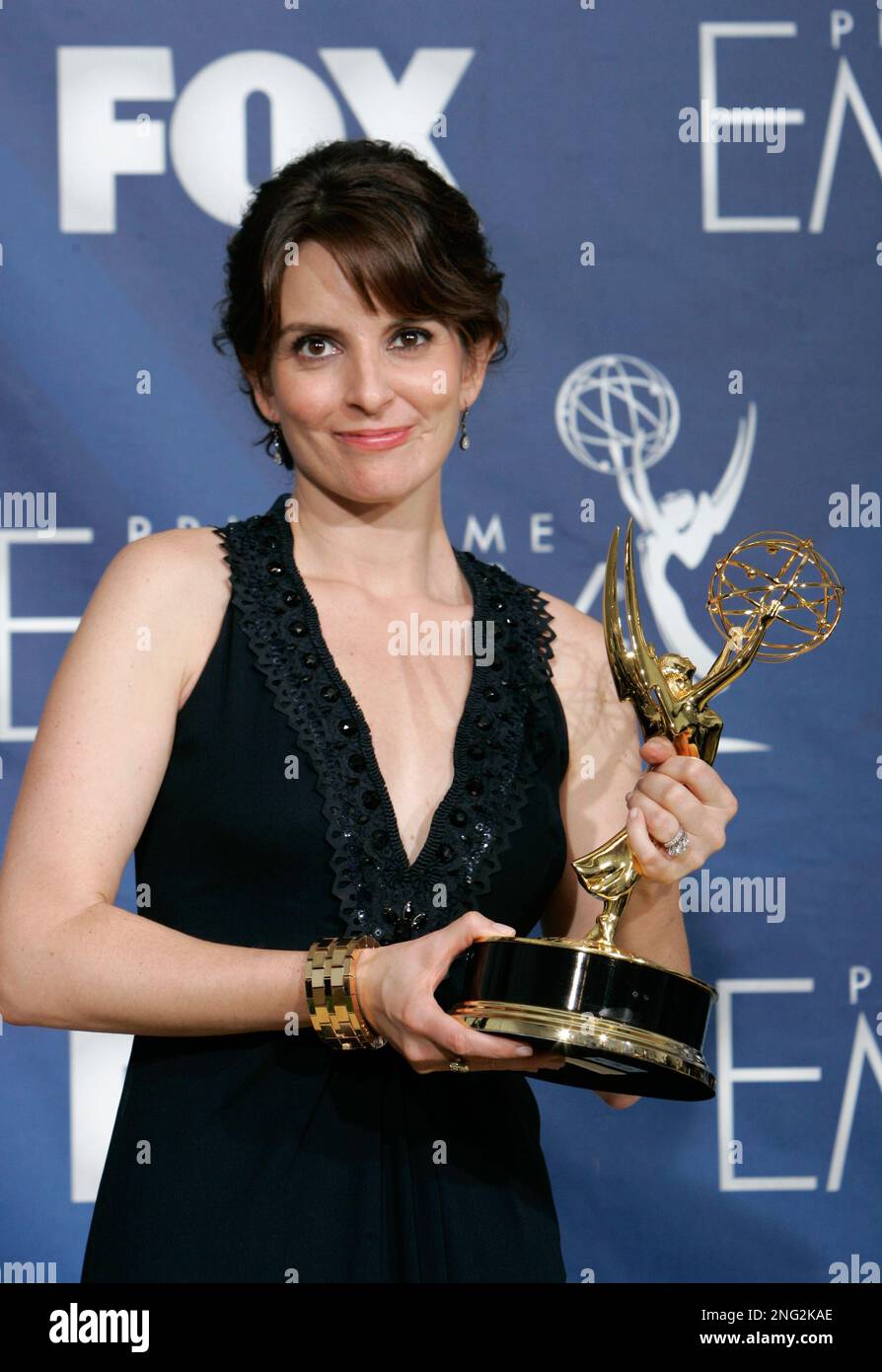 Tina Fey poses with the award for outstanding comedy series for their ...