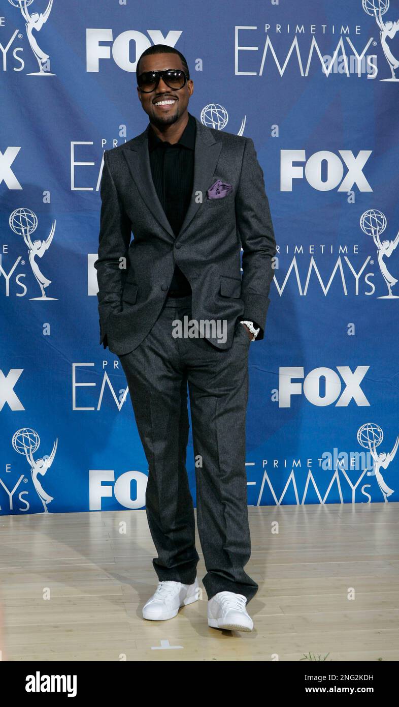 Kanye West poses for photographers backstage at the 59th Primetime Emmy ...