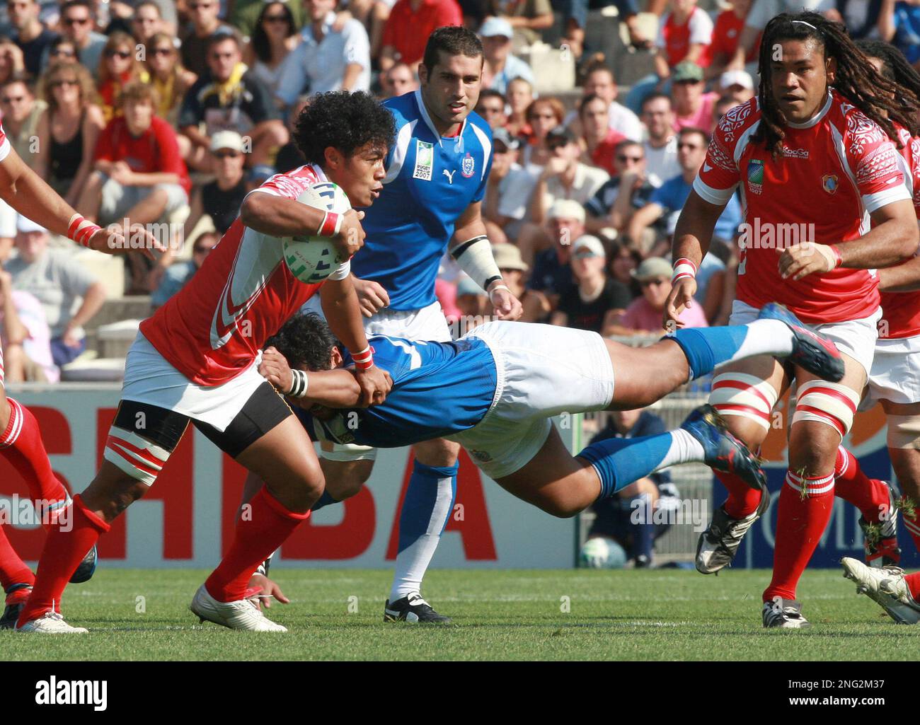 Samoa's Seilala Mapusua, right, tackles Tonga's Enele Taufa during the ...