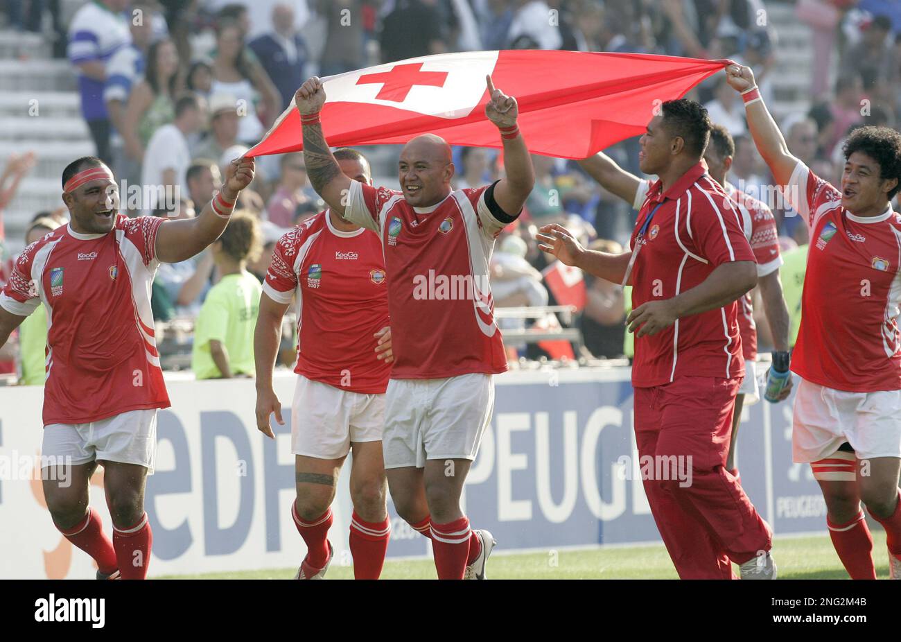 Tongan players celebrate after winning the Rugby World Cup Group A ...