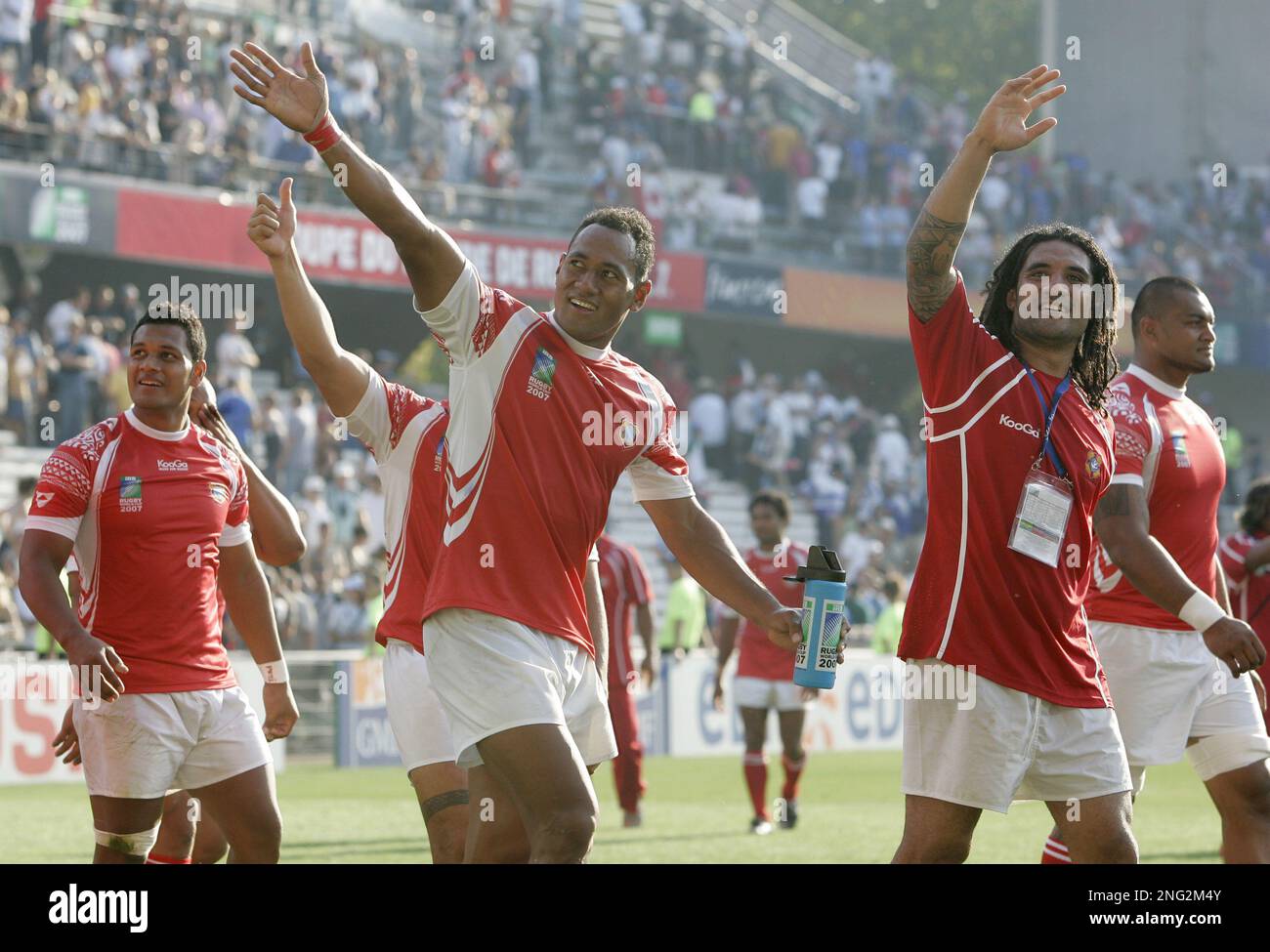 Tongan players celebrate after winning the Rugby World Cup Group A ...