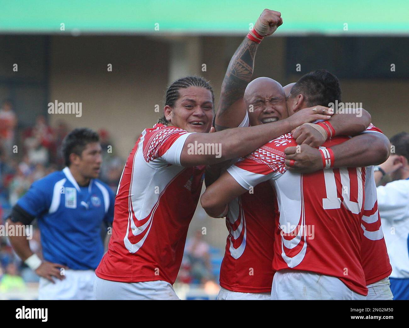 Tongan players Joseph Vaka, left, Nili Latu , center, Pierre Hola ...