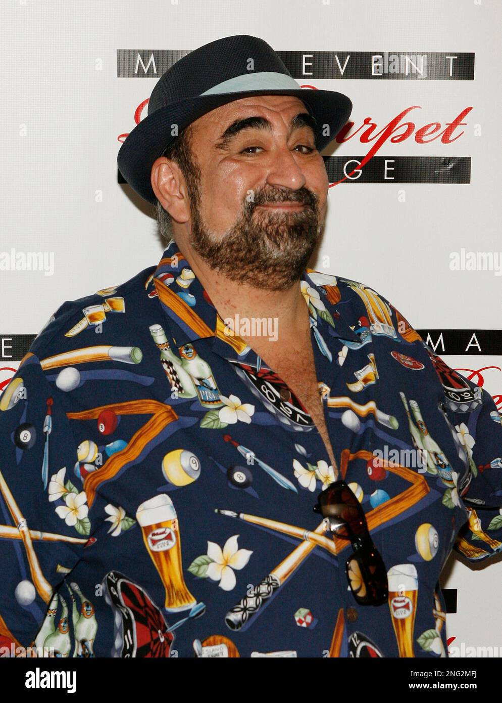 Ken Davitian poses for photographers at The Main Event Red Carpet ...
