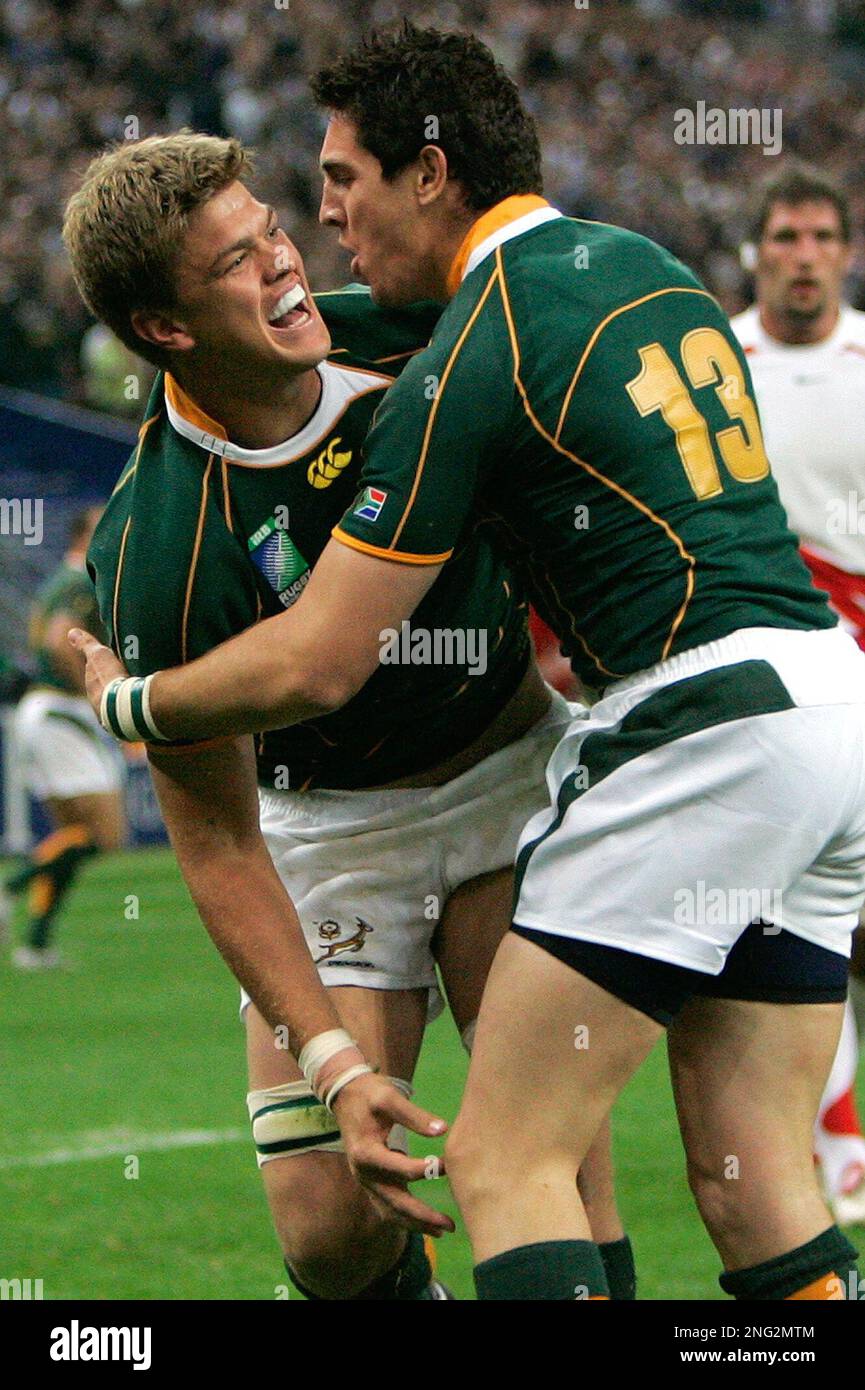 Jaque Fourie of South Africa, right, greets teammate Juan Smith after ...