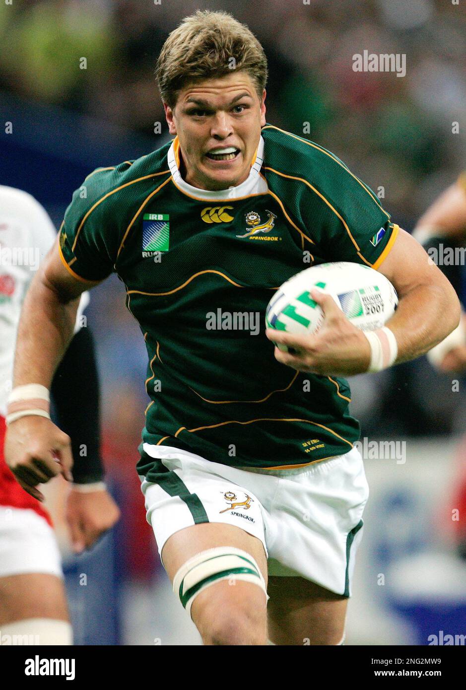 Juan Smith of South Africa runs on his way to score his team's first ...