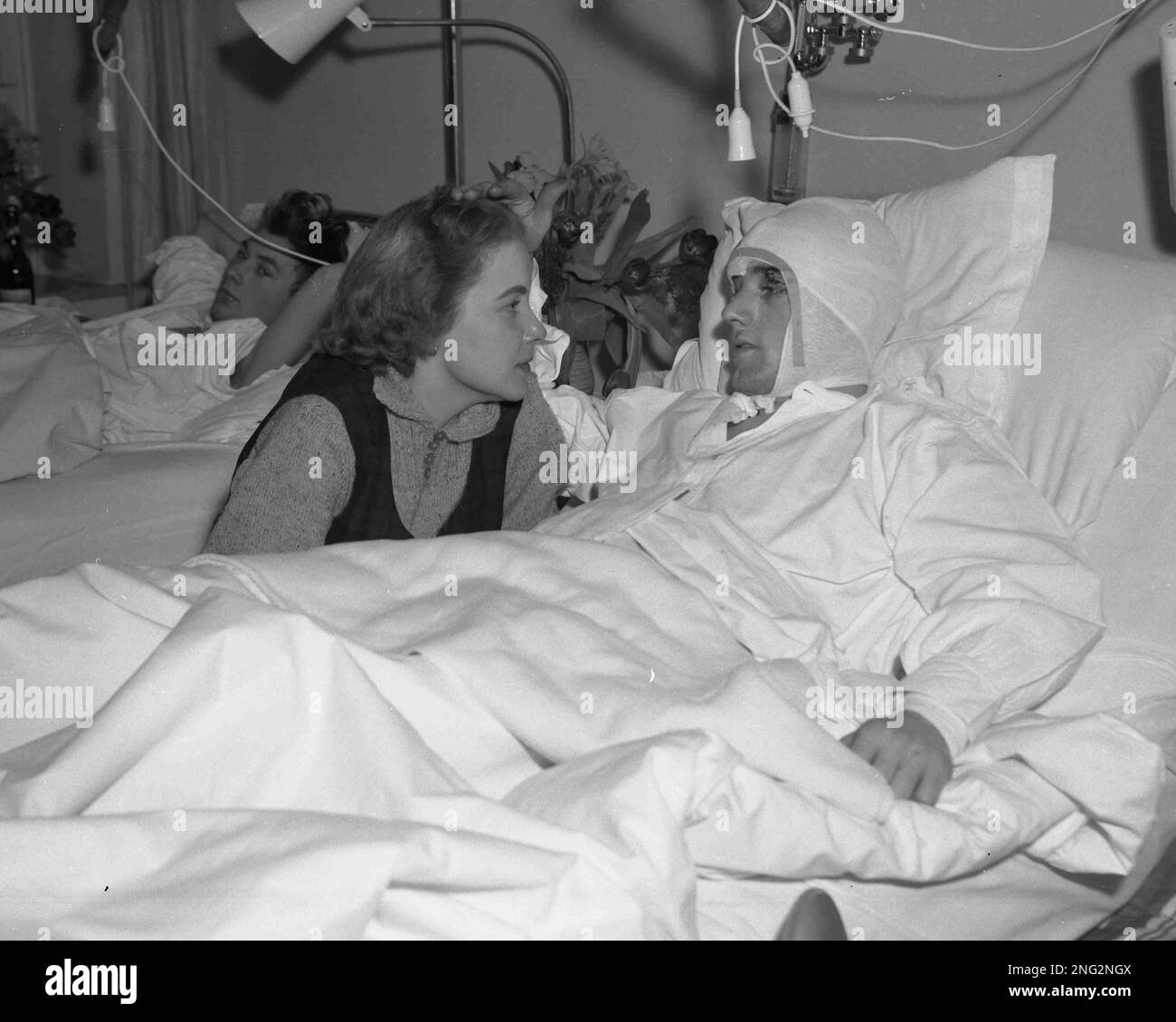 Manchester United footballer Albert Scanlon talks with his wife ...