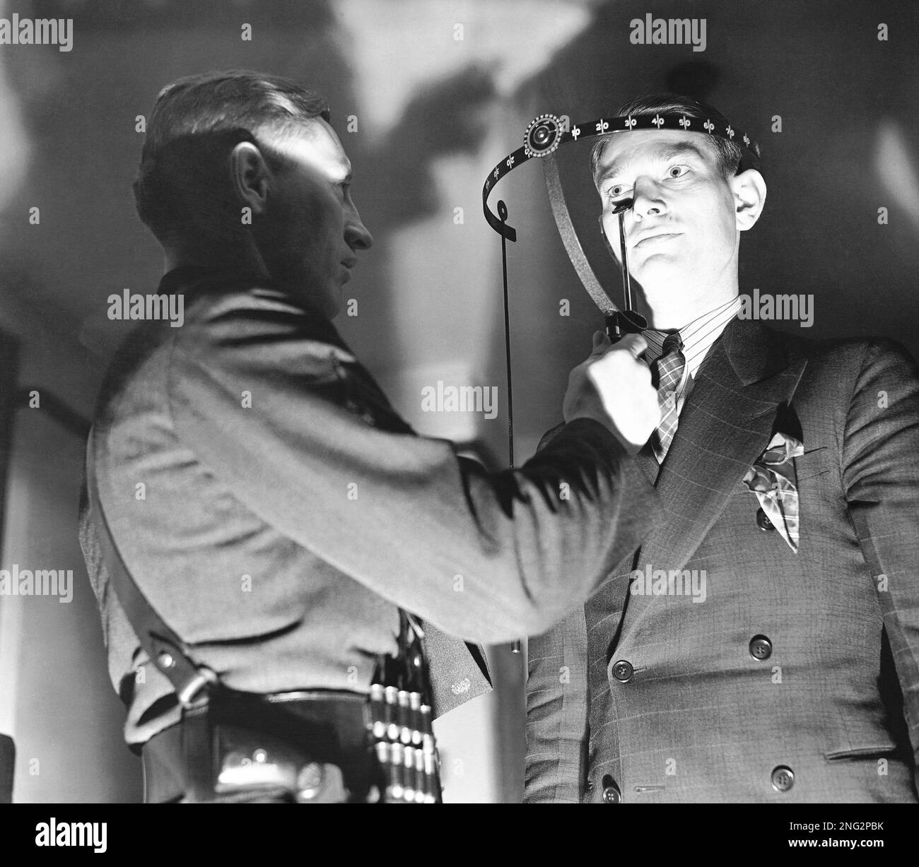 A motorist undergoes an eye examination by a Pennsylvania Highway ...