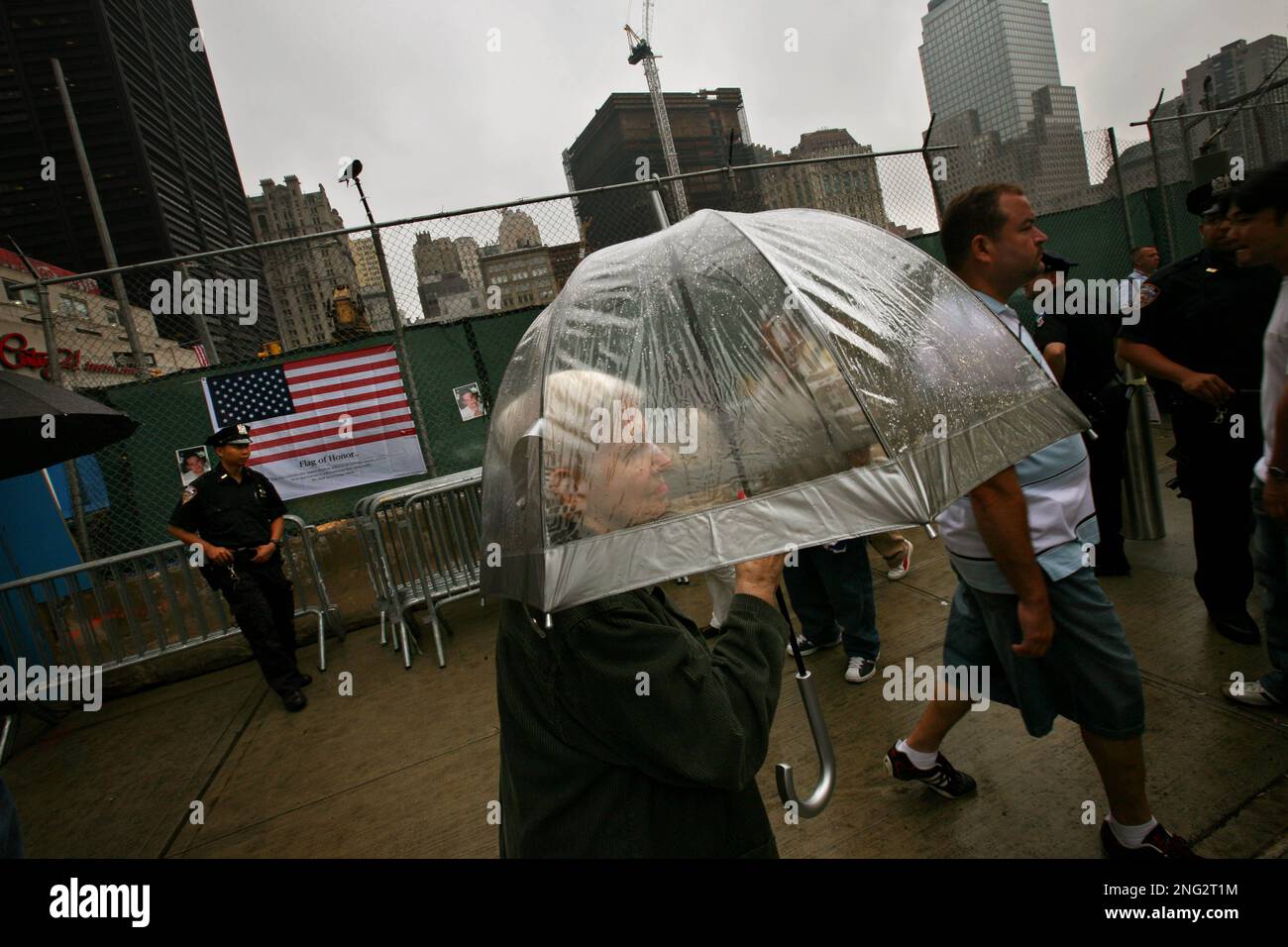 A crowd gathers near ground zero in New York to commemorate the sixth ...